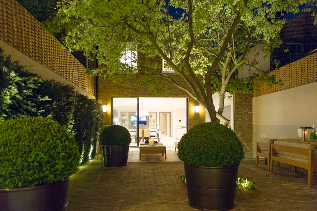 Planters and architectural metalwork in patinated brass, 54 Bedford ...